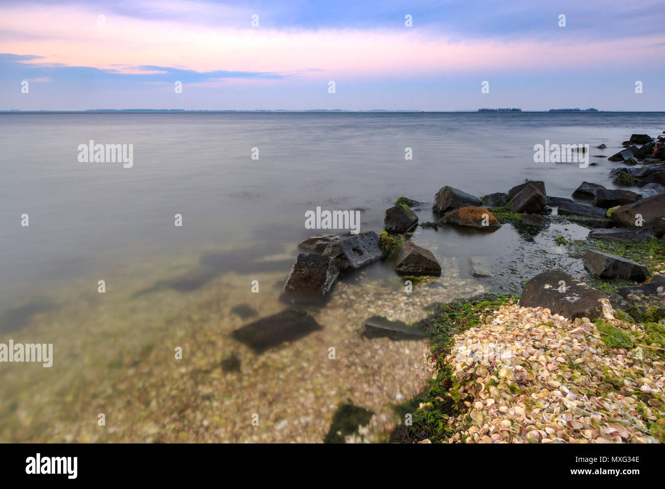 Rocks on the zeeland coast of the netherlands hi-res stock photography ...