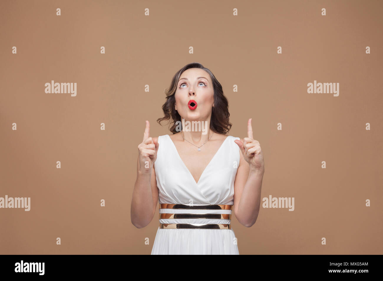 Look up pointing woman hi-res stock photography and images - Alamy
