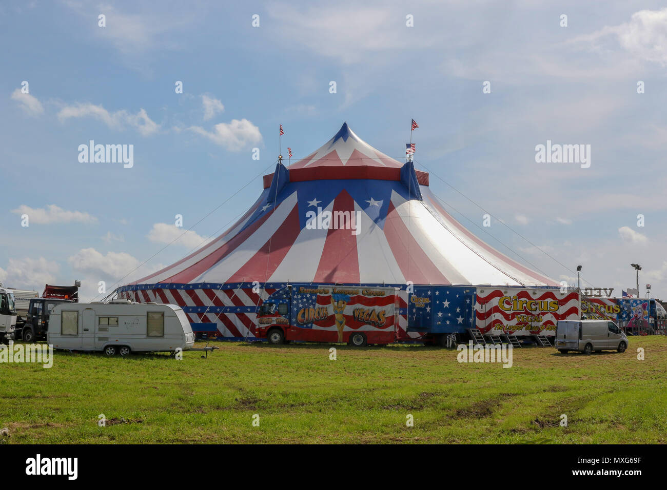 Circus vehicles beside American coloured circus tent belonging to ...