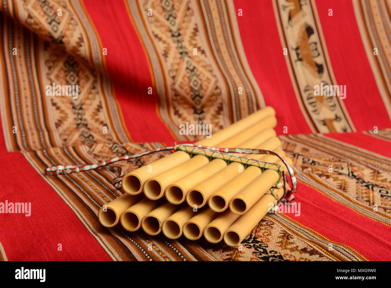 Panpipes from South America on a textile background Stock Photo - Alamy