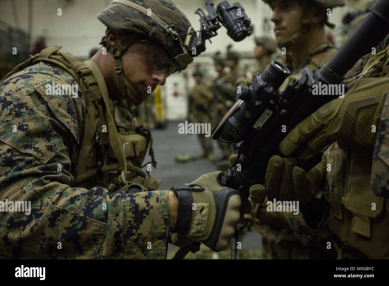 U.S. Marine Cpl. David E. Pinto, a team leader, conducts a pre-combat ...