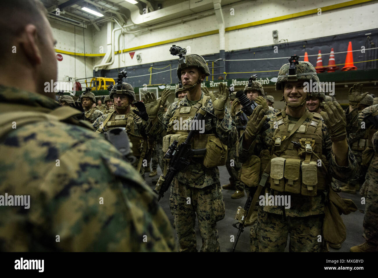 U.S. Marine Sgt. Nicholas Lollock conducts a pre-combat inspection with ...