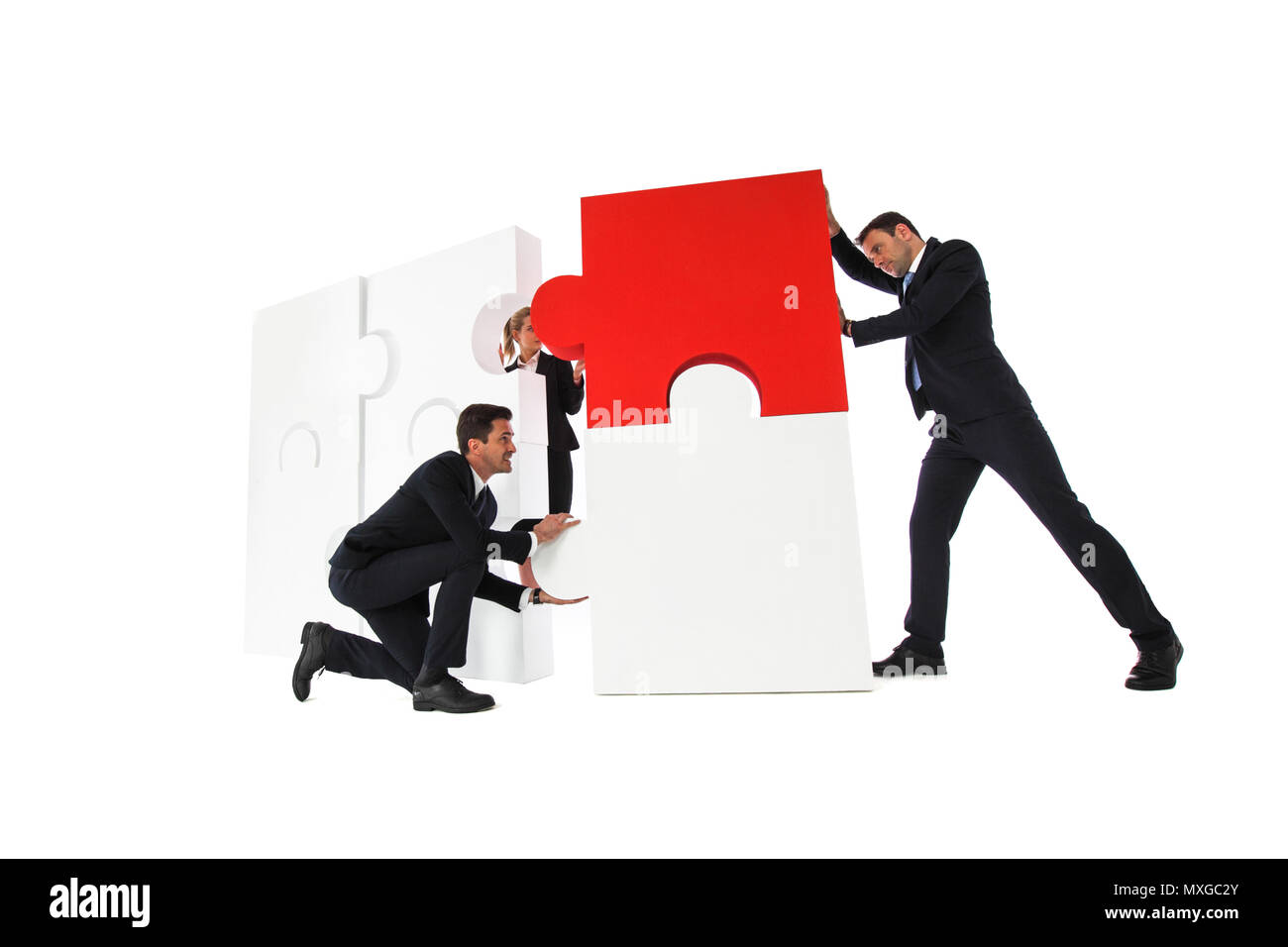 Business team assembling big puzzle isolated on white background Stock ...