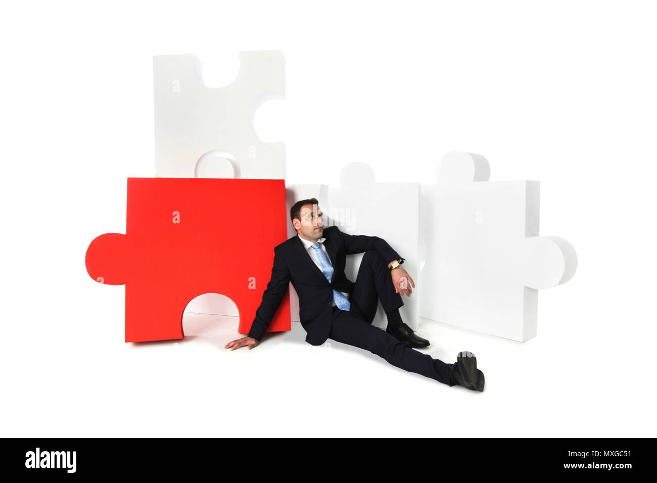 Thinking business man and puzzle isolated on white Stock Photo - Alamy