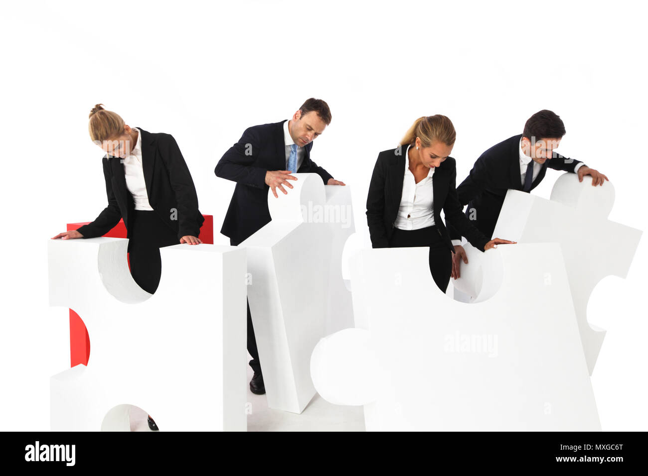 Business team assembling big puzzle isolated on white background Stock ...