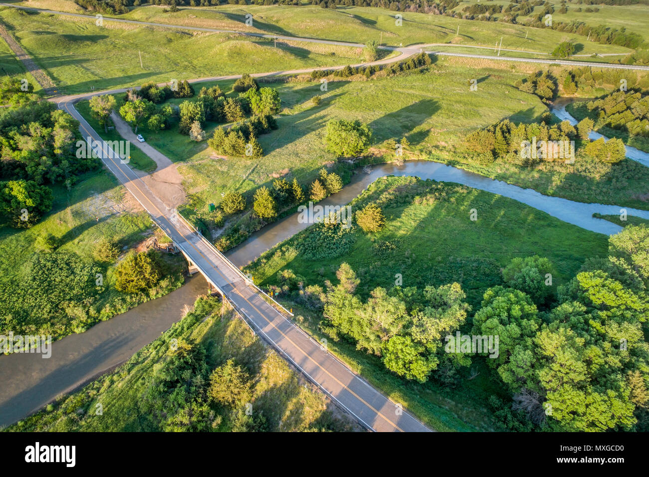 aerial view of a highway and bridge over the Dismal River in Nebraska ...