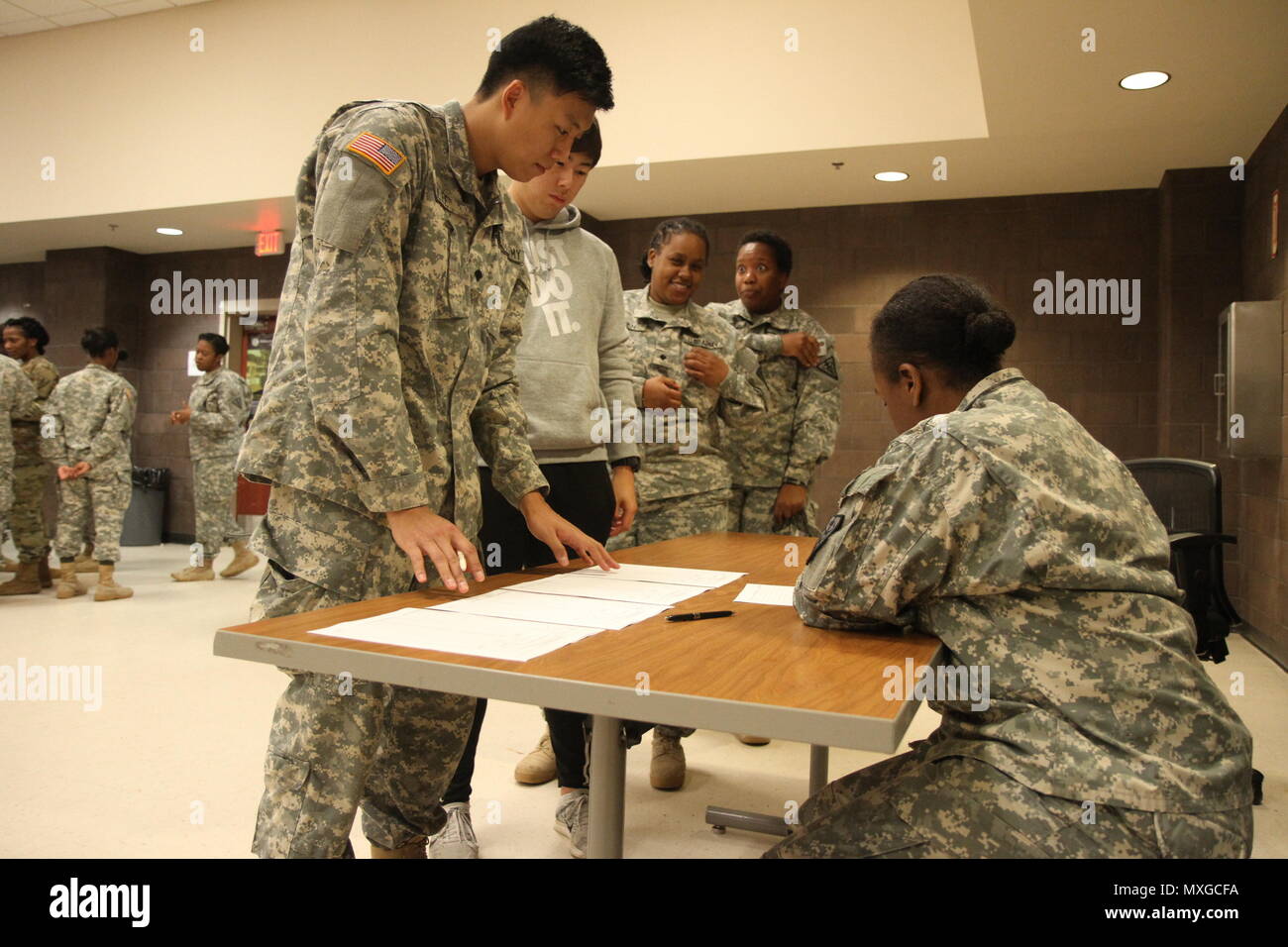 Soldiers line up and sign for their lunch at the 3d Medical Command ...