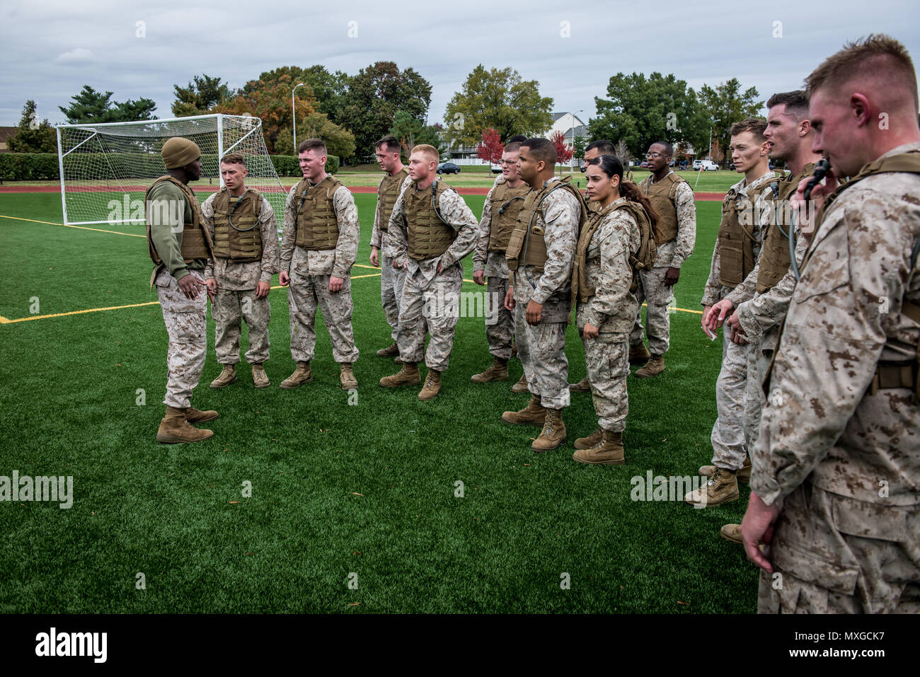 Marine Sgt. Kenneth Eaton tells the group of trainees the rules to the ...