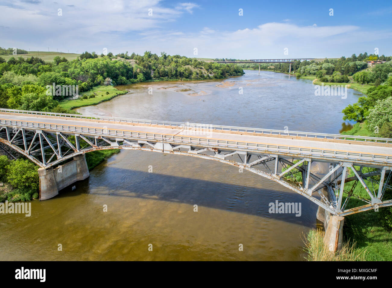 Niobrara River with a historic pin-connected arch Bryan bridge built in ...