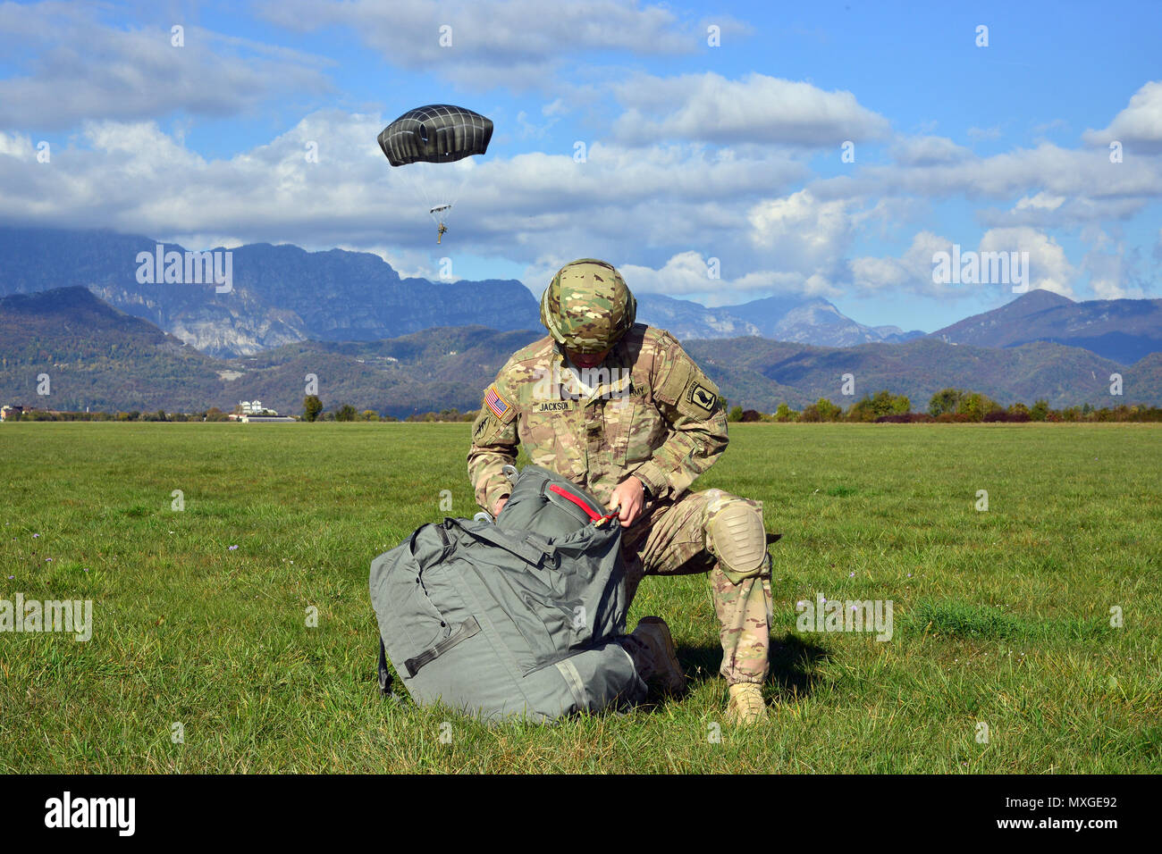 U.S. Army paratrooper Sgt. Christopher Jackson, recovers his T-11 ...