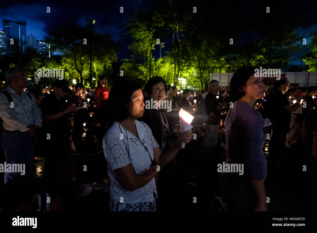 People take part during the candlelight vigil in Hong Kong. 4th June, 2018. Thousands of ...
