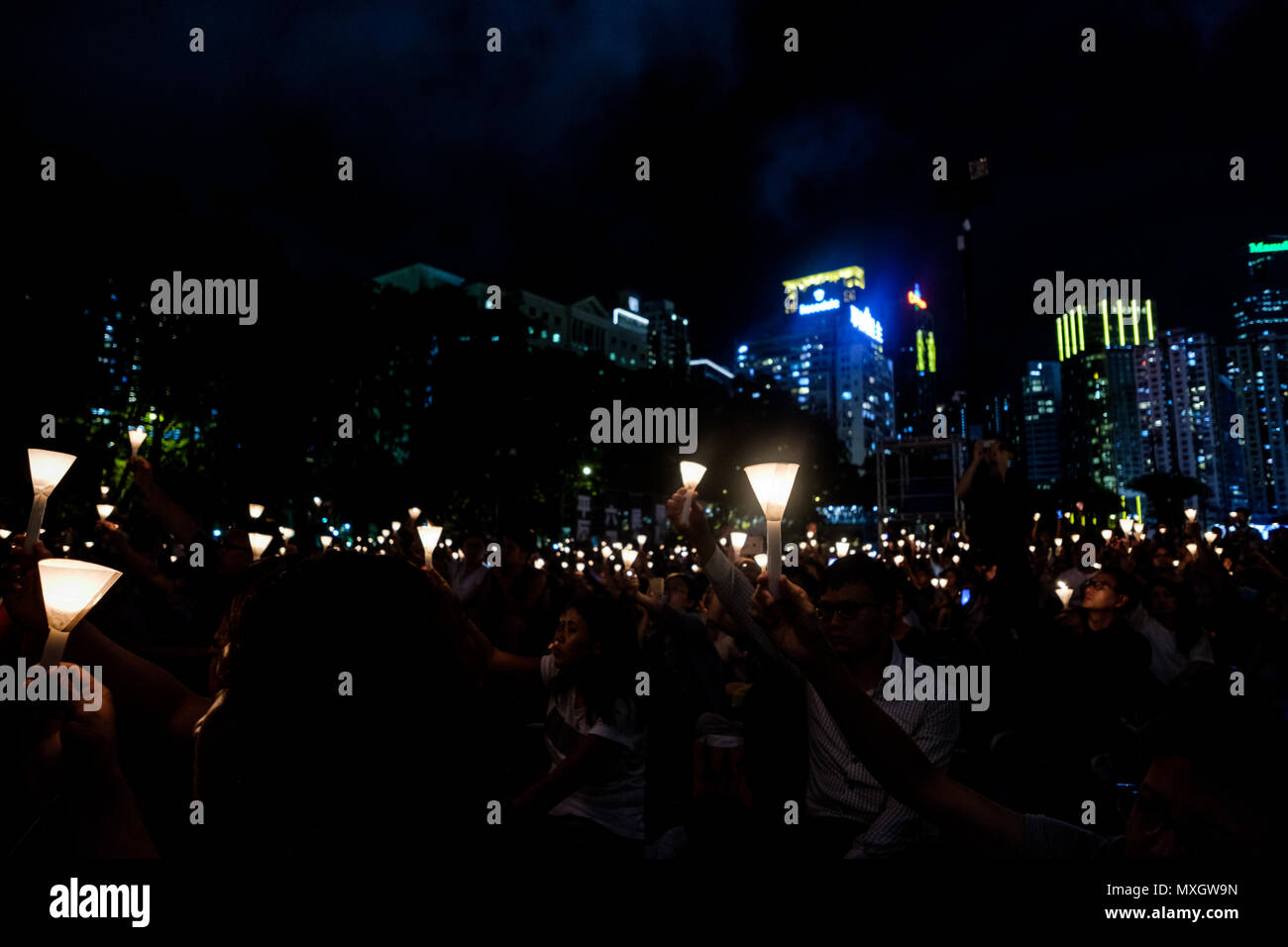 People take part during the candlelight vigil in Hong Kong. 4th June, 2018. Thousands of ...