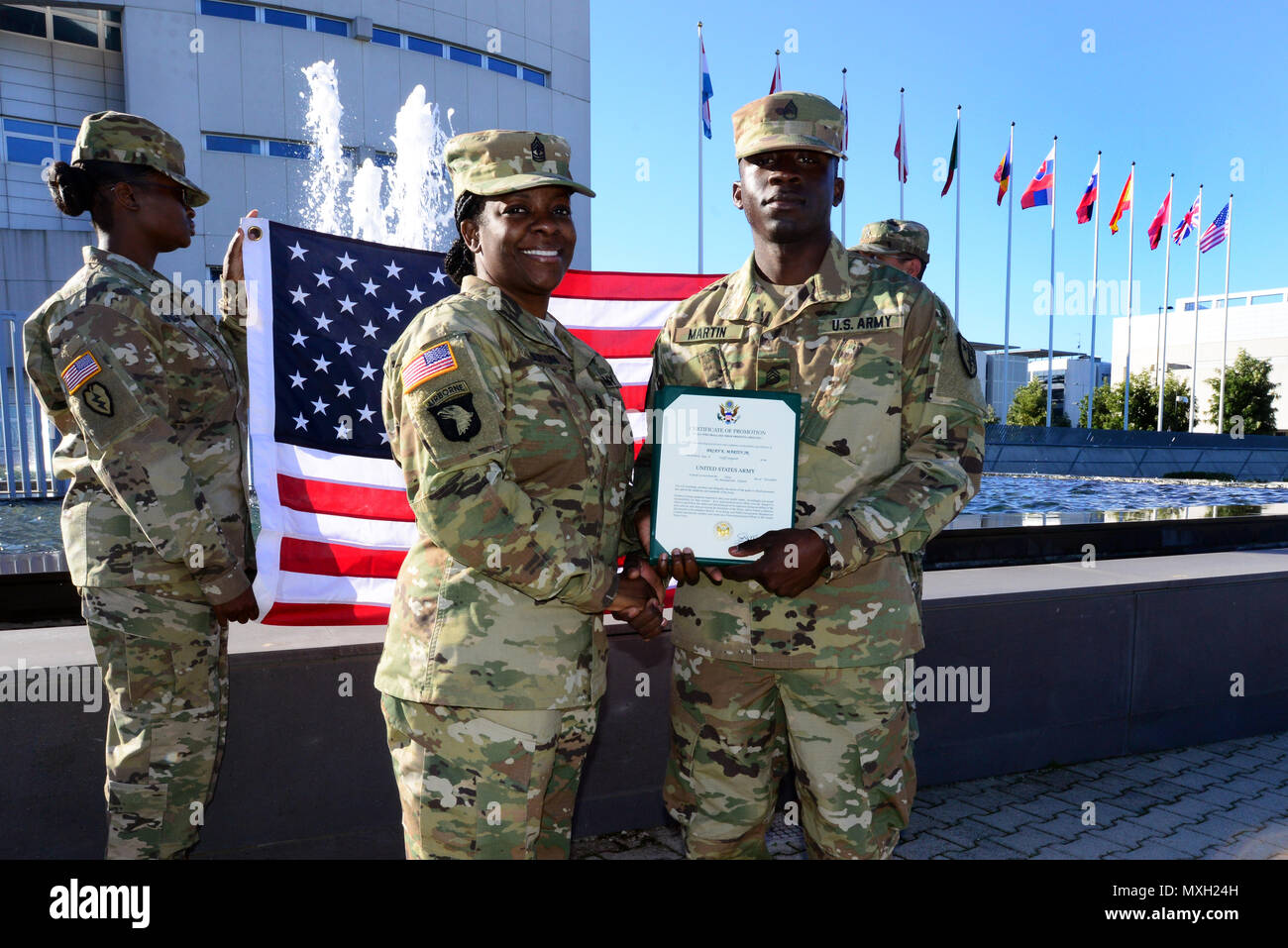 U.S Army 1st Sgt. Ta Mouton Presents Staff Sgt. Brian K. Martin his ...