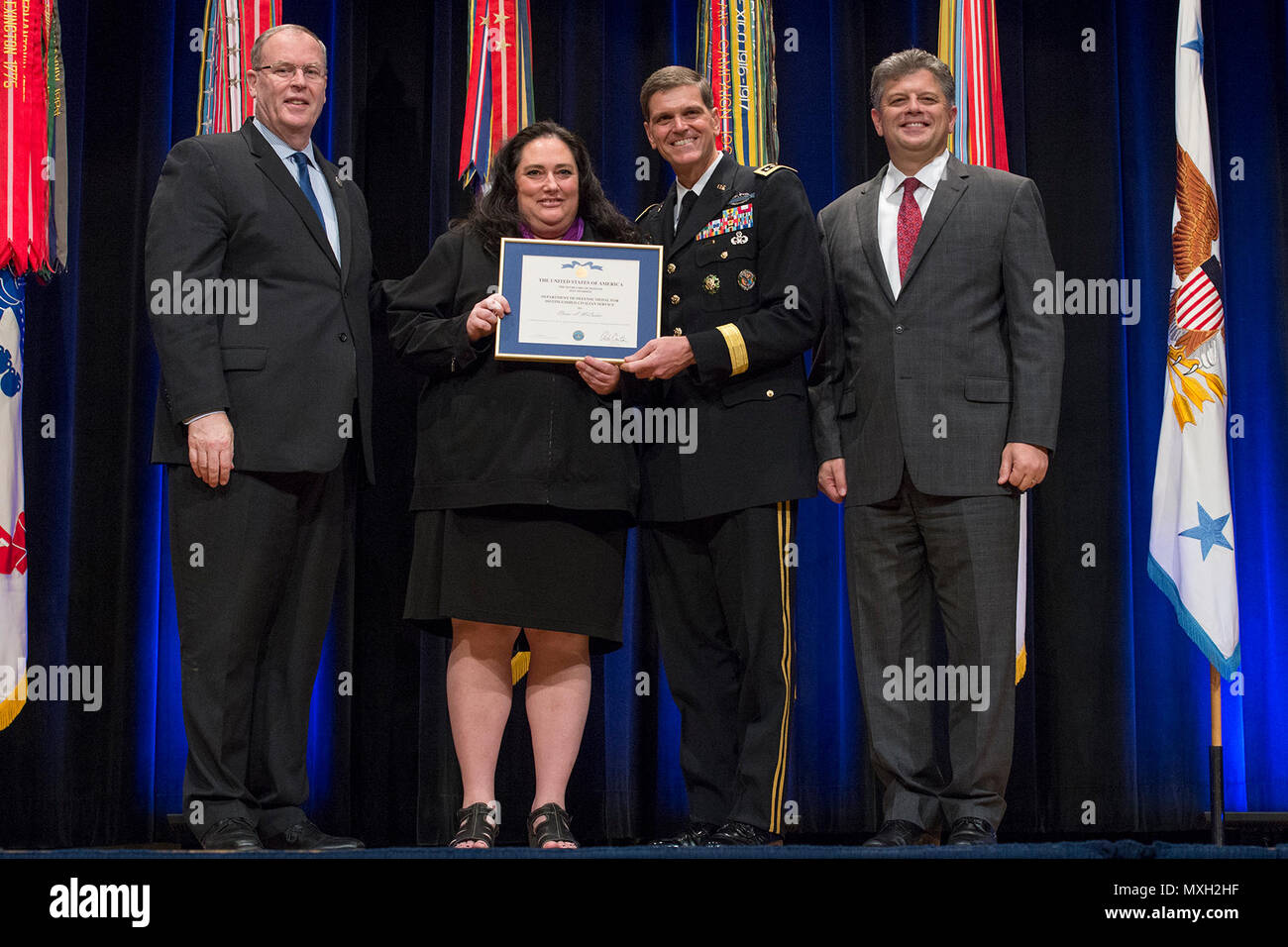 Elaine McCusker of United States Central Command holds her ...