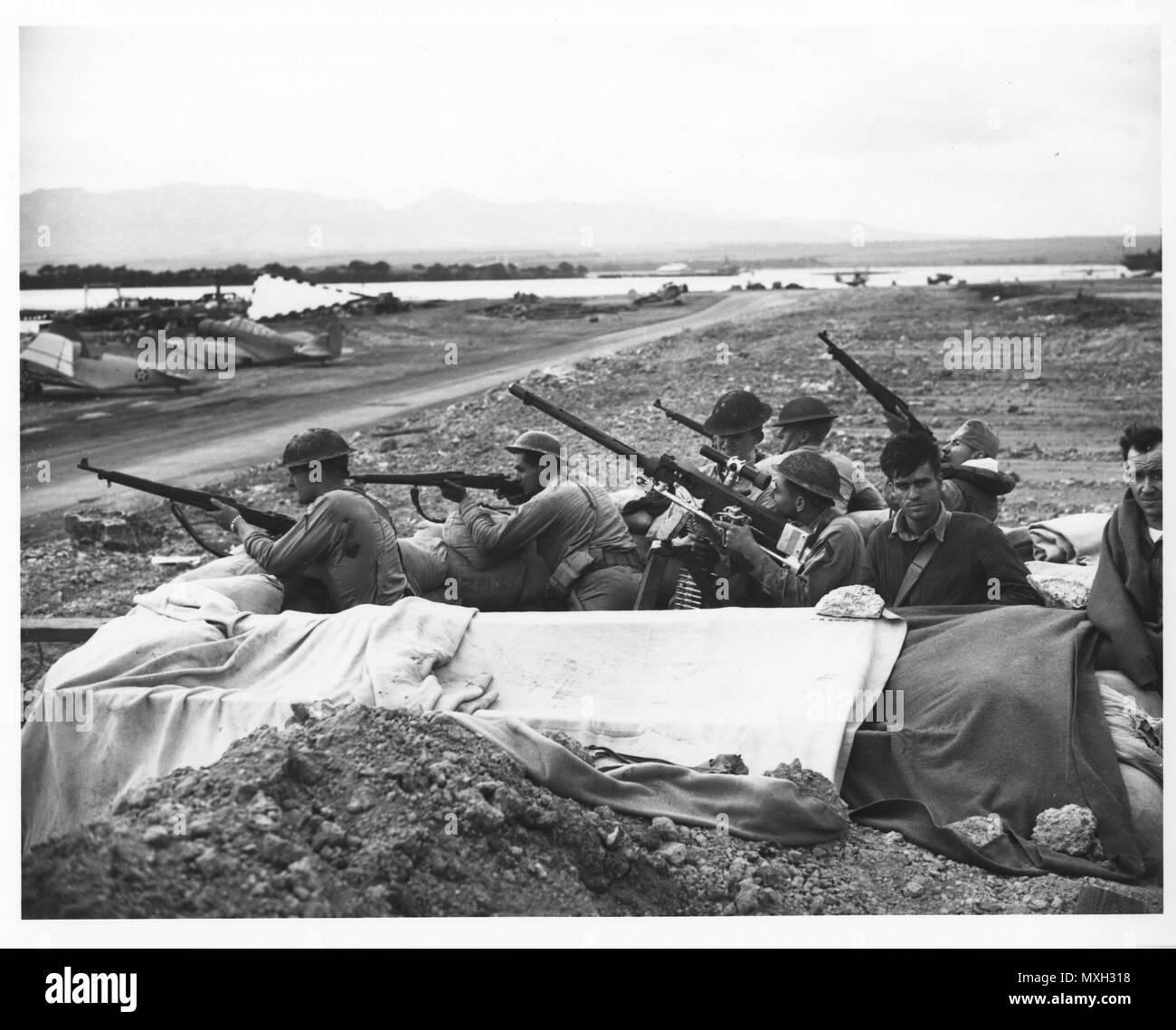 Original caption: Gun crews during the Japanese attack on Pearl Harbor ...