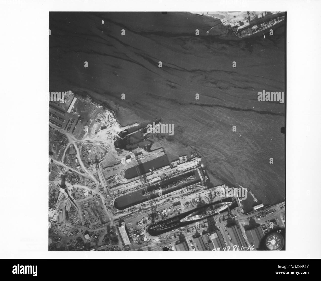 Original caption: Ships at Pearl Harbor, T.H. following the Japanese ...