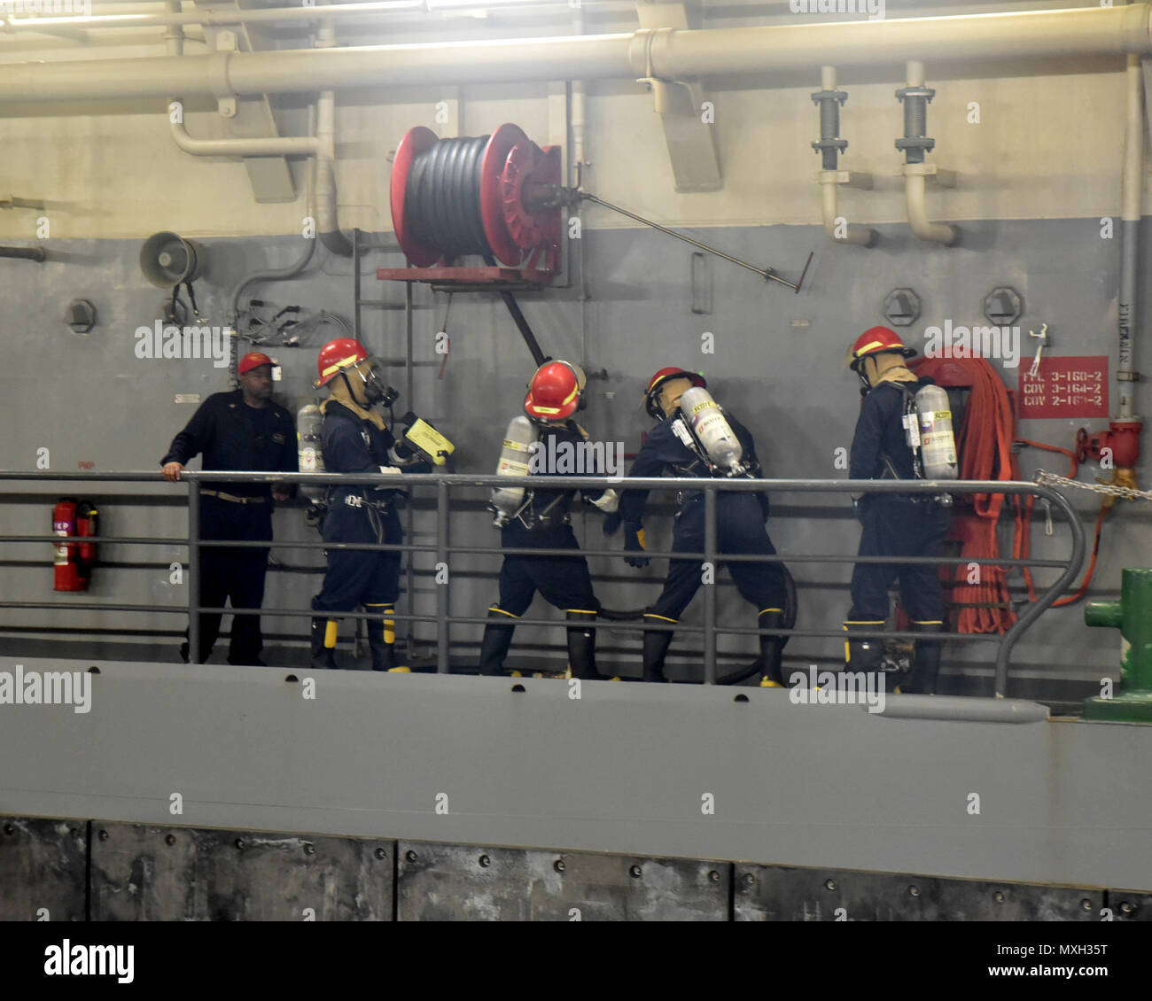 161101-N-BT947-018 PACIFIC OCEAN (Nov 1, 2016) A hose team unreels a ...