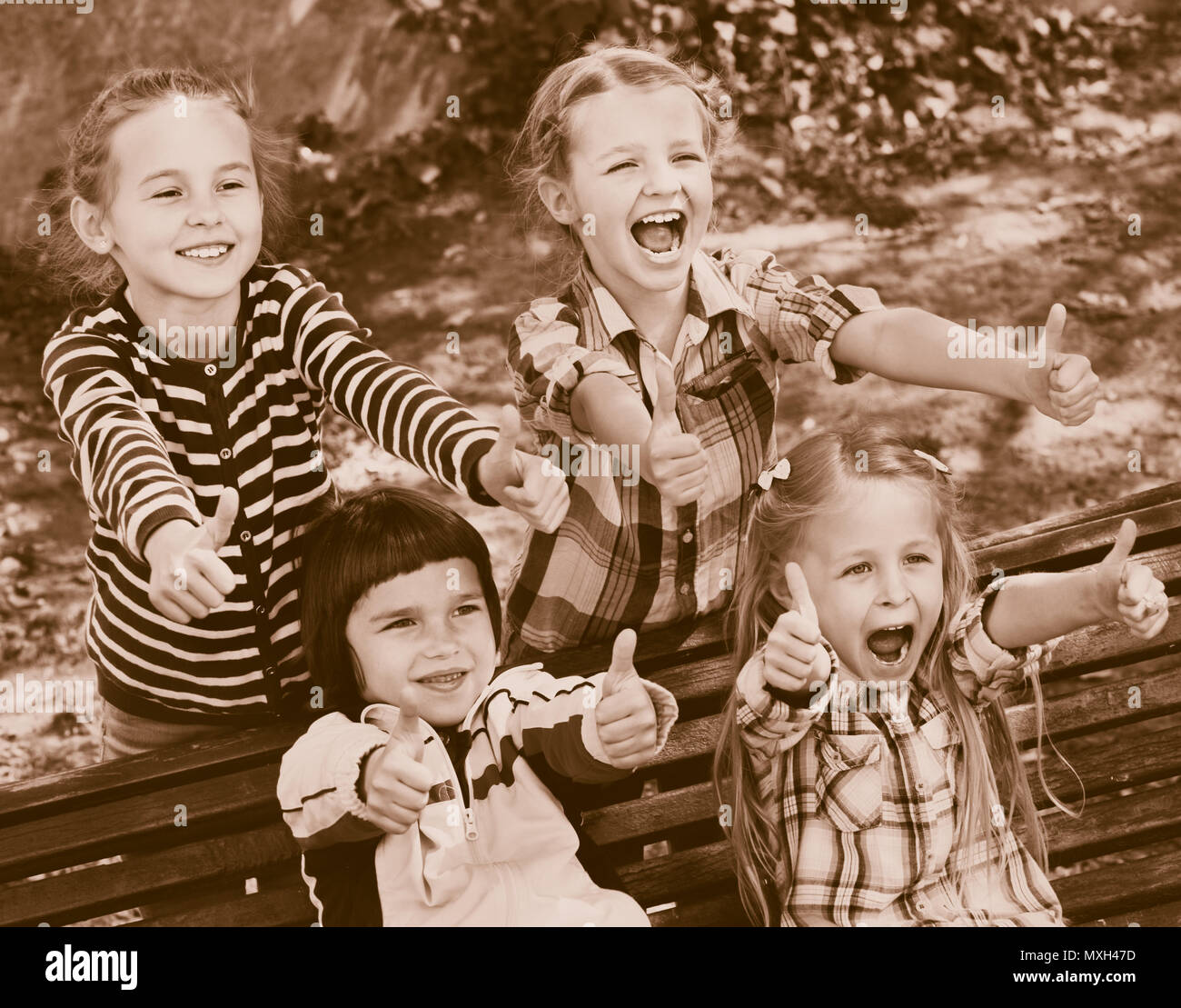 Cheerful children holding hands and giving friendship swear Stock Photo ...
