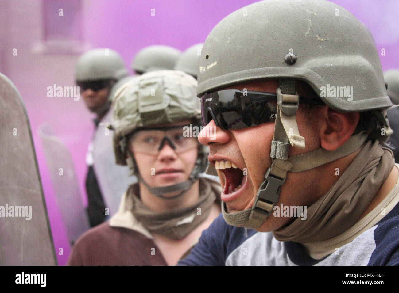 A Soldier acting as a member of the oppositional forces antagonizes ...