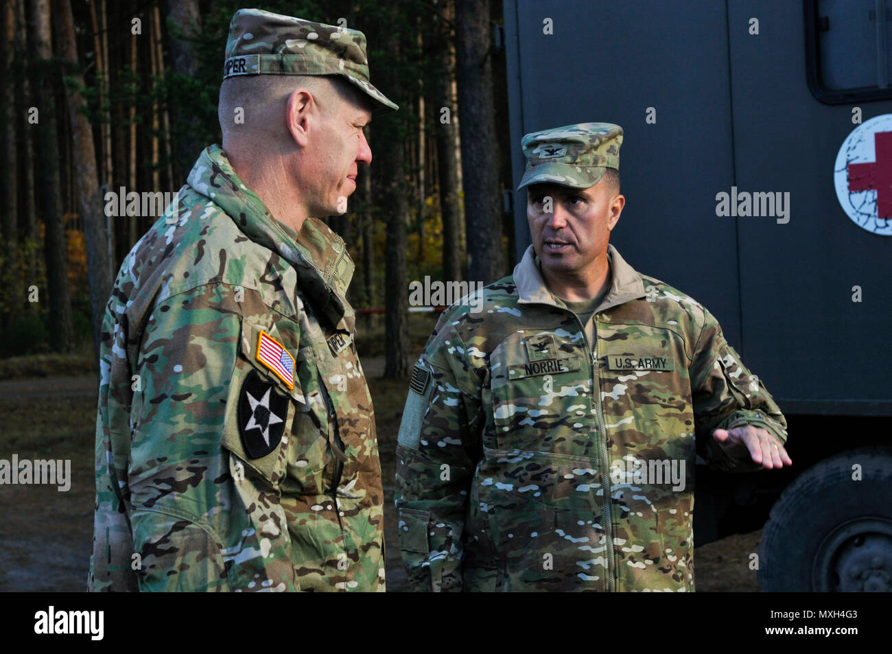 U.S. Army Brig. Gen. Kenneth L. Kamper (left), deputy commanding ...