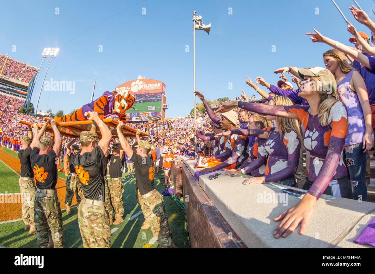 Clemson Tigers fans cheer as the Clemson Tiger does push-ups - with the ...