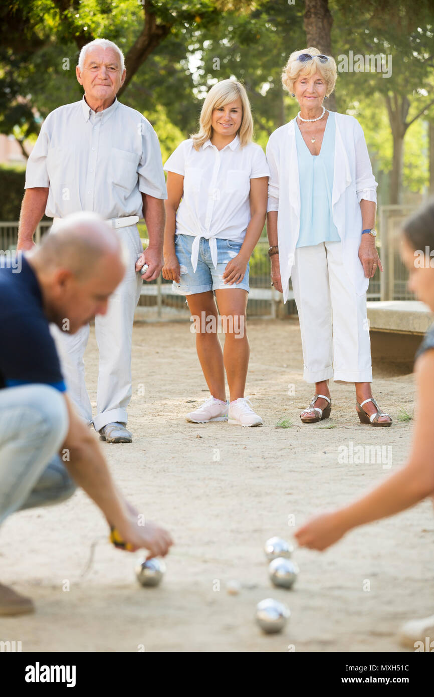 Playing bocce ball in park hi-res stock photography and images - Alamy