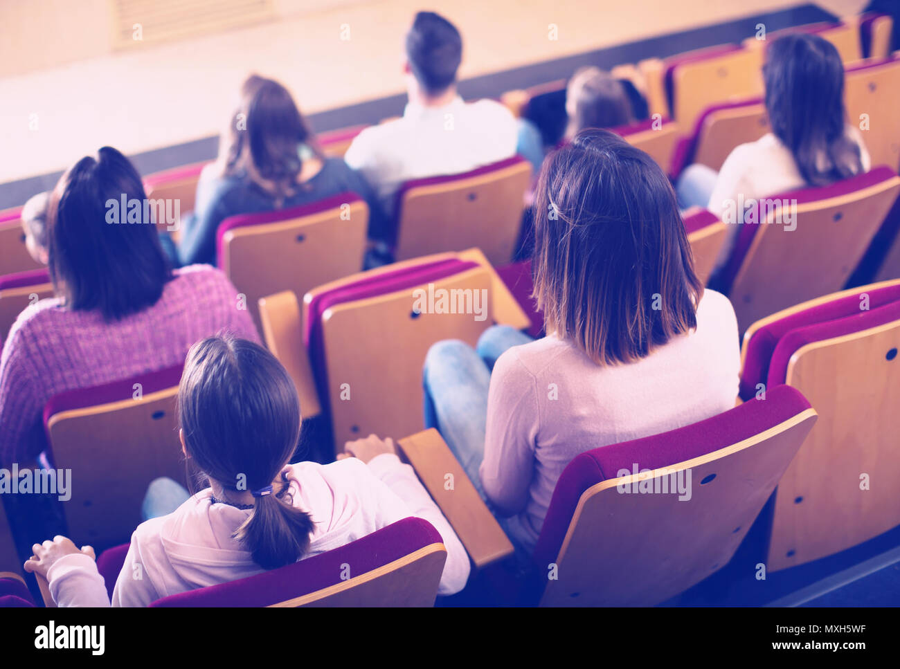 Group of people waiting for beginning of movie in cinema Stock Photo ...