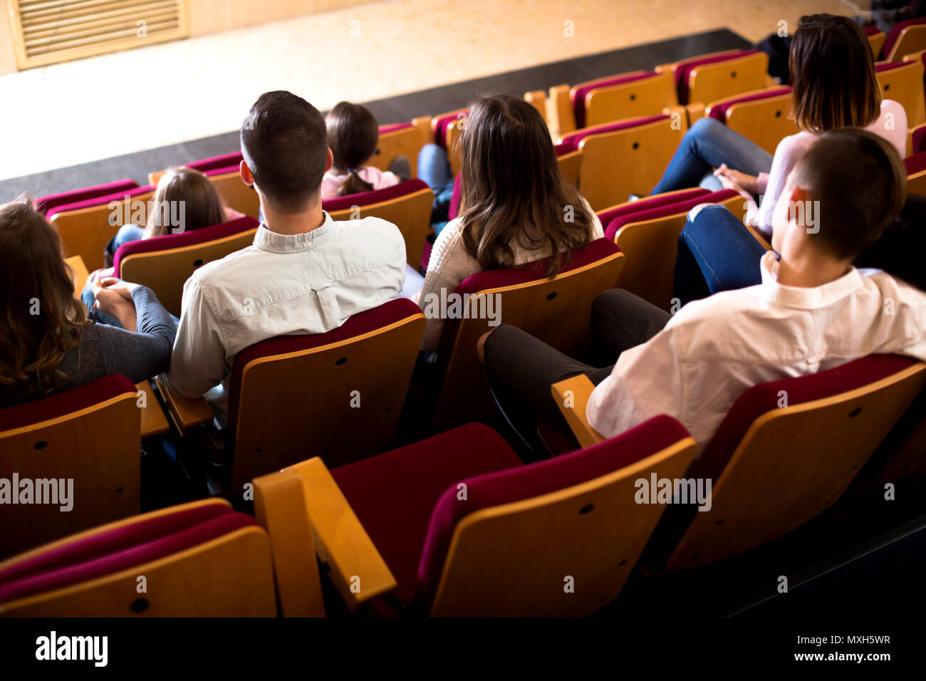 People and children waiting for movie to start in cinema house Stock ...