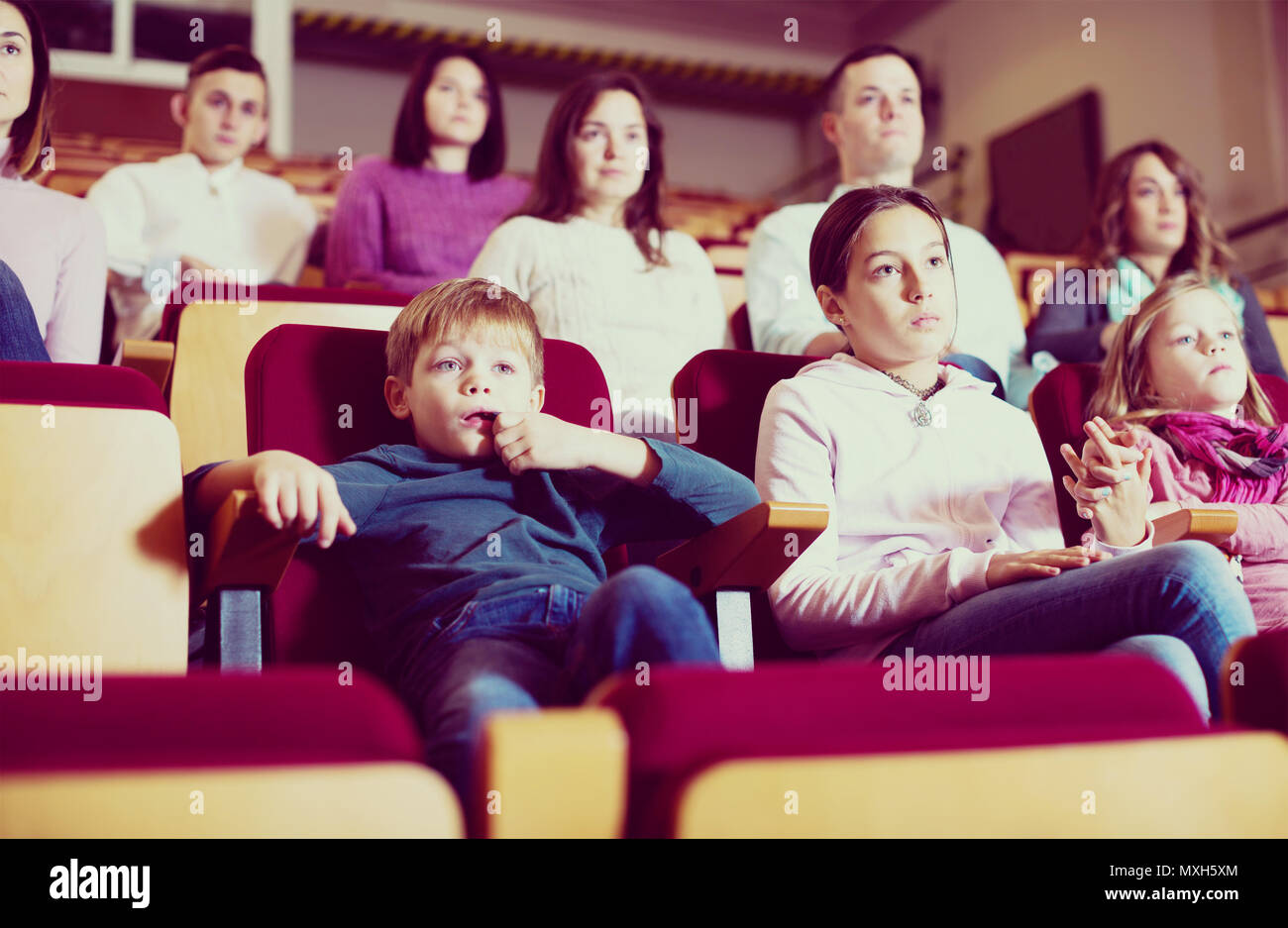 People audience attending movie night in cinema house Stock Photo - Alamy