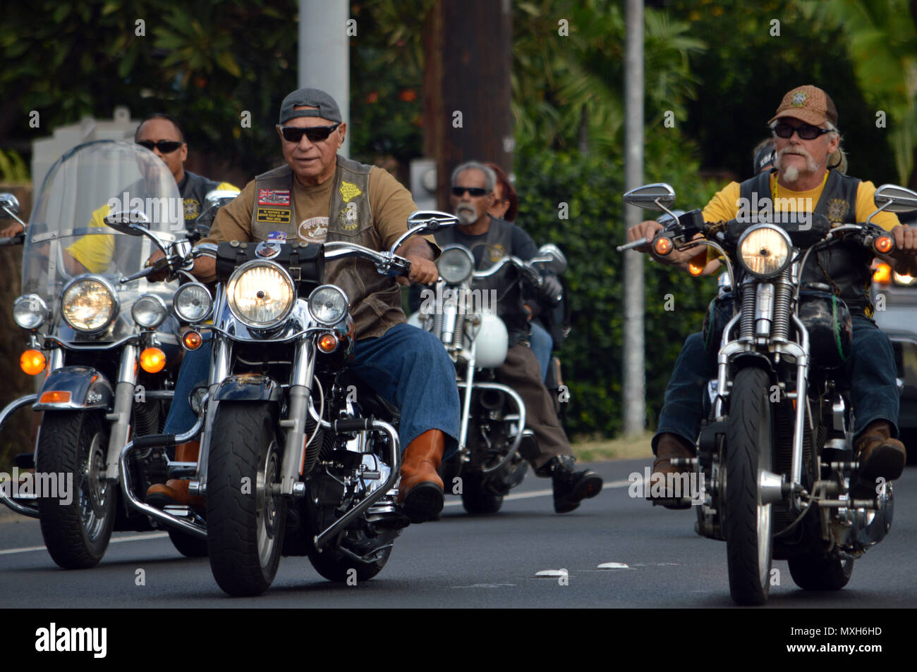 Members of Koa Puna Motorcycle Club ride down Farrington Highway at the ...