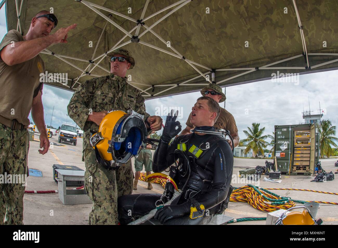 Seaman Lucas Jackson, center, assigned to Underwater Construction Team ...