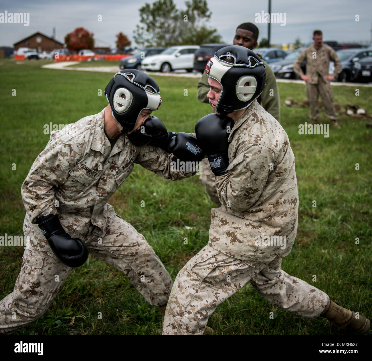 Lance Cpl. Tanner J. Commerer absorbs a punch to his nose from PFC ...
