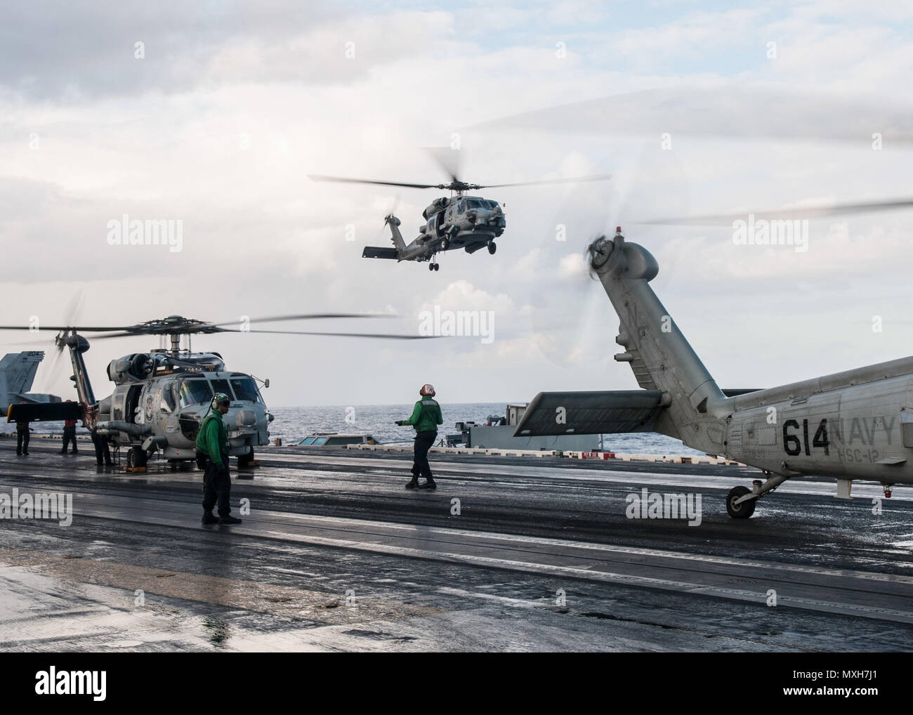 An MH-60S Sea Hawk, assigned to the “Golden Falcons” of Helicopter ...