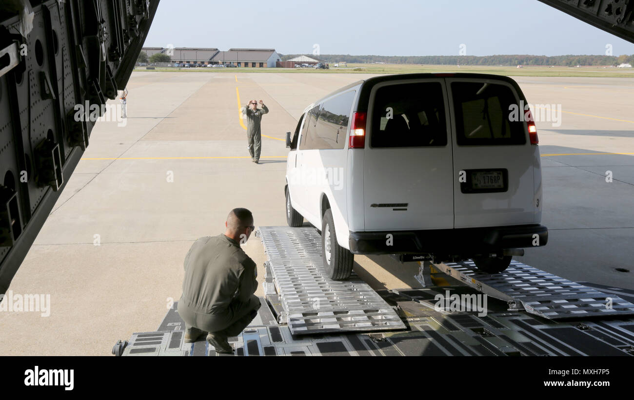 Air Force Master Sgt. James Fuller (foreground), a loadmaster with the ...