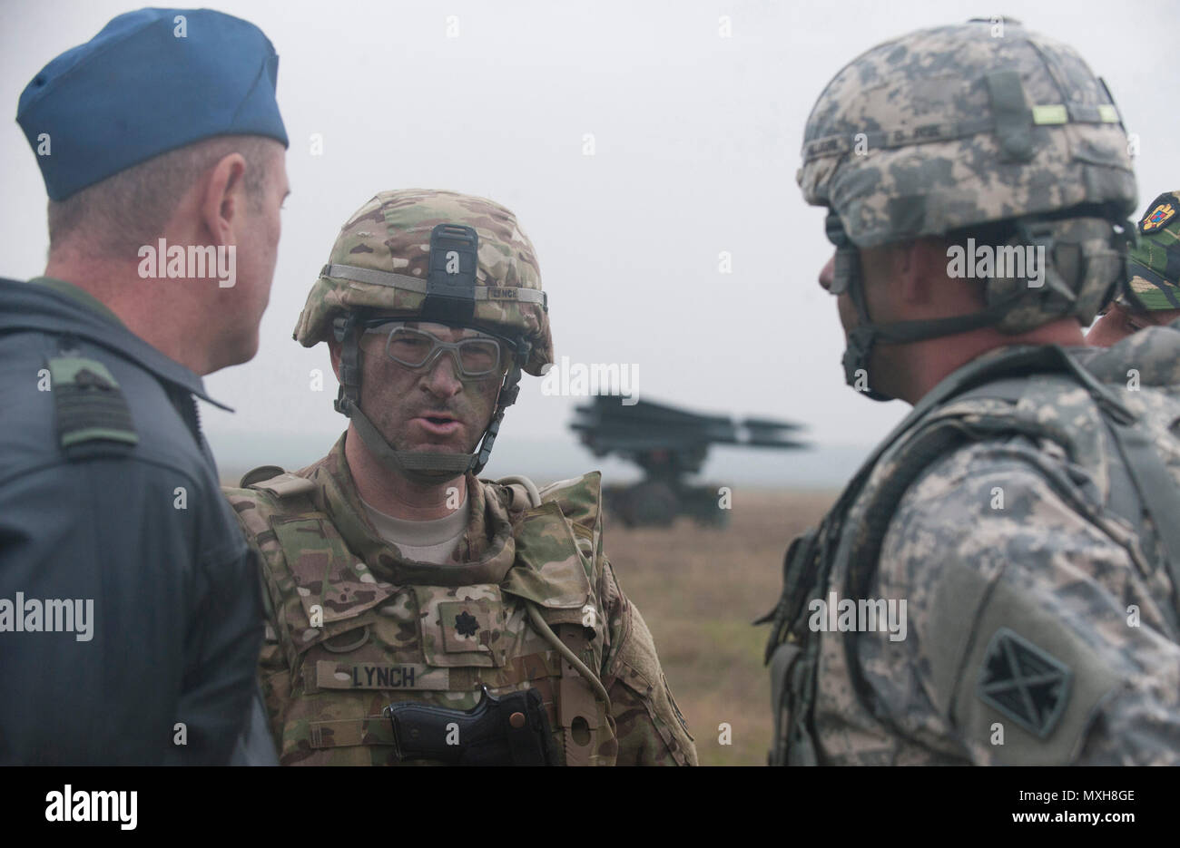 U.S. Army Lt. Col. Douglas Lynch (center), Commander of the 10th Army ...