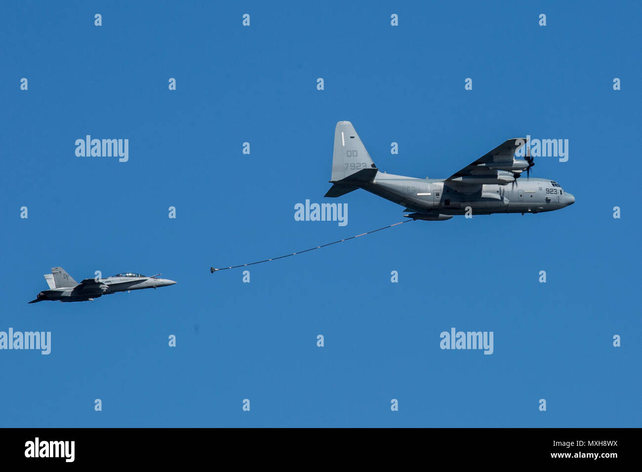 An F/A-18D Hornet with Marine All-Weather Fighter Attack Squadron (VMFA) 242, and a KC-130J ...