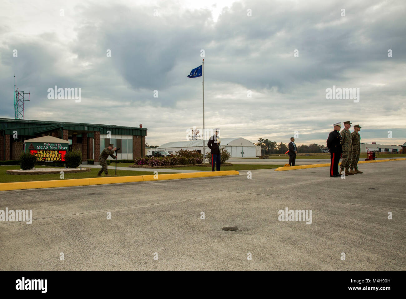 U.S. Marines stand by to greet and welcome the Secretary of the Navy ...