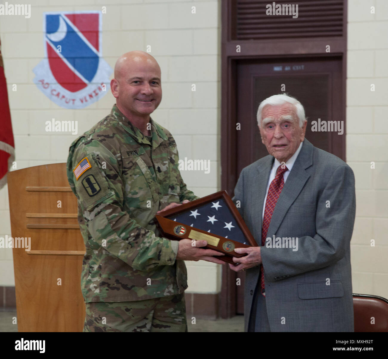 Mr. William Zimmerman receives a U.S. Flag from U.S. Army Lt. Col ...