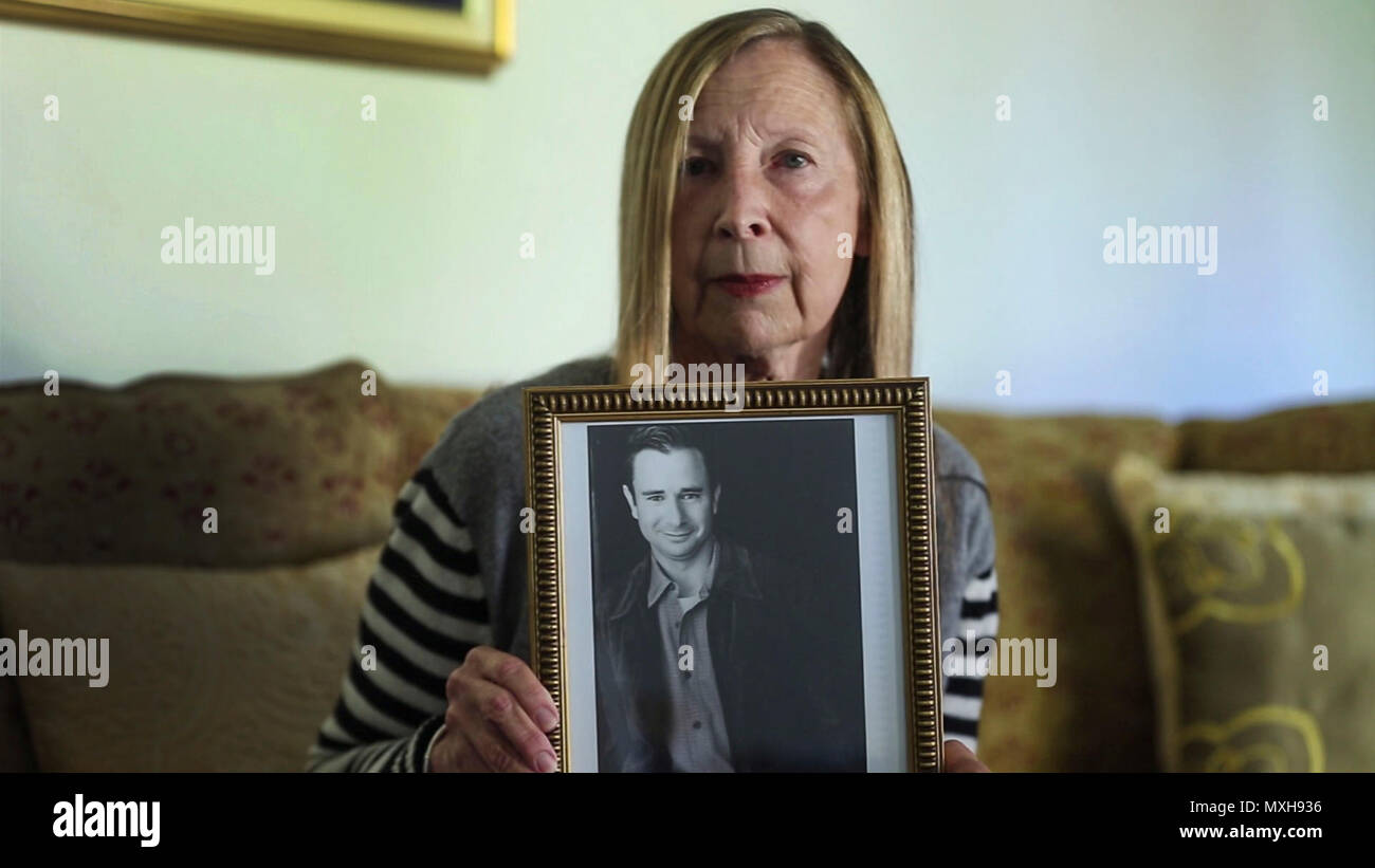 ORANGE COUNTY, Calif. – Maxine Russell shows a photograph of her son ...