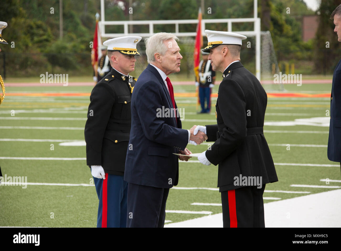 Secretary of the Navy Ray Mabus, left, shakes hands with U.S. Marine ...