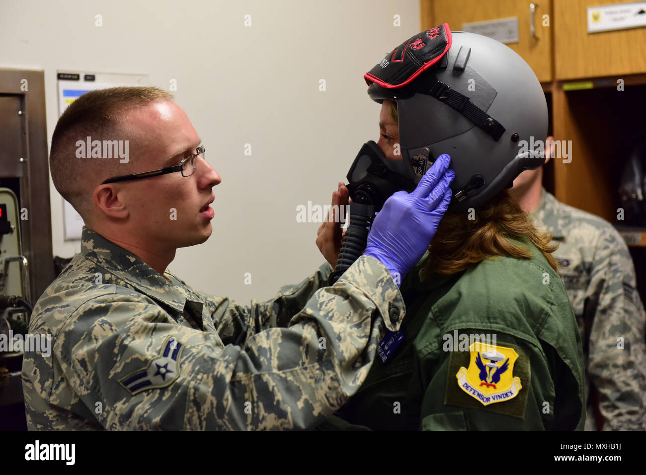 U.S. Air Force Airman 1st Class Jeremy Becker, left, an aircrew flight ...