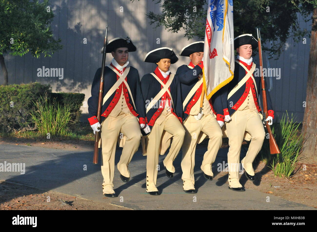 The 63rd Regional Support Command Ceremonial Color Guard marches while ...