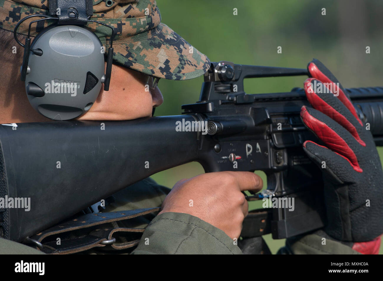 A Marine aims down his sights during the Marine Corps Shooting Team ...