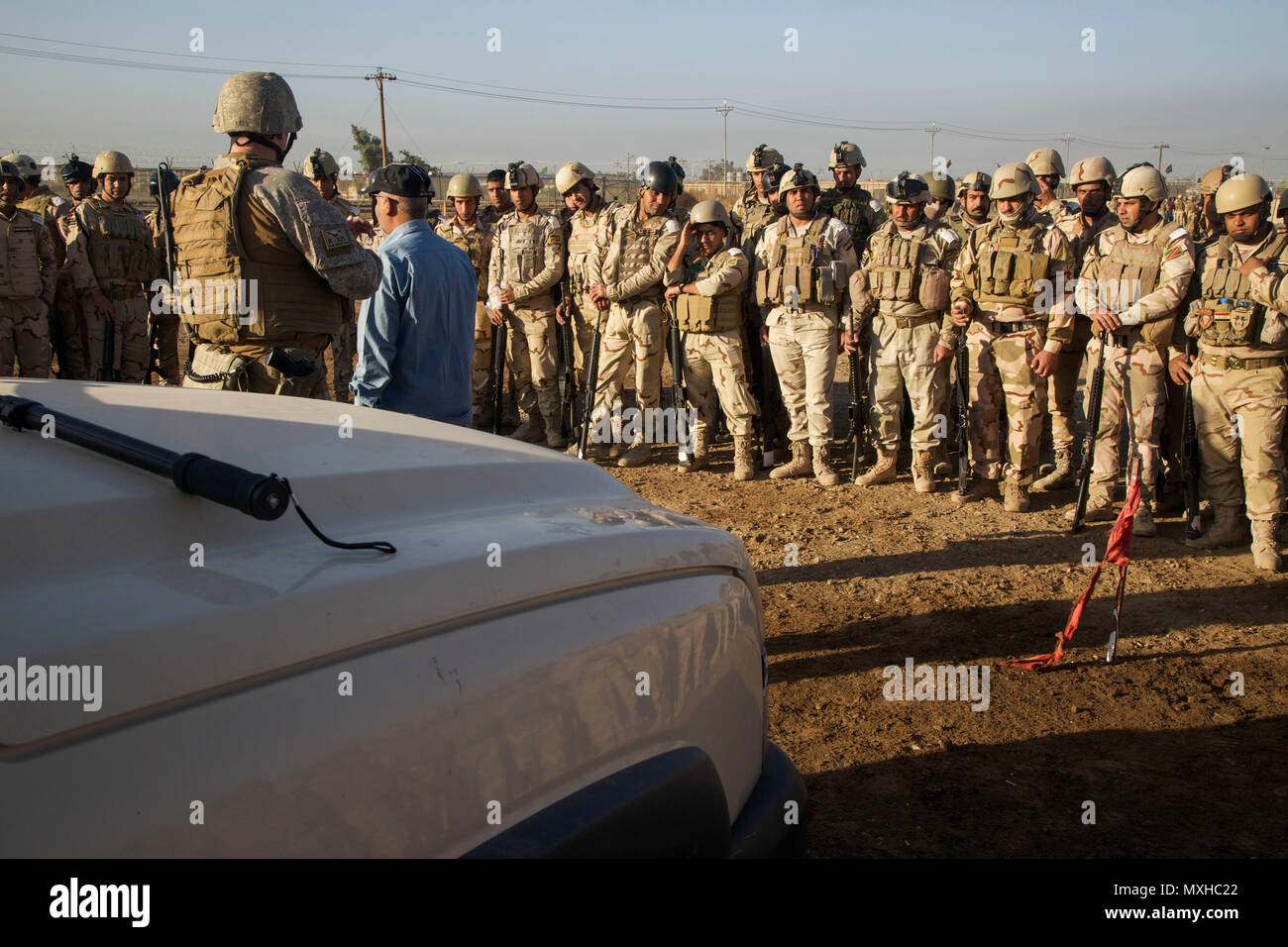 A New Zealand trainer instructs Iraqi soldiers during traffic-control ...