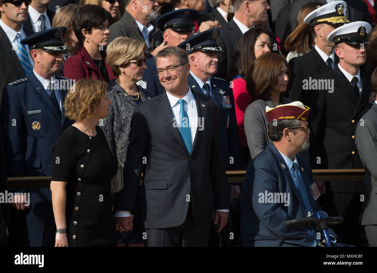 Secretary of Defense Ash Carter stands with his wife before a wreath ...