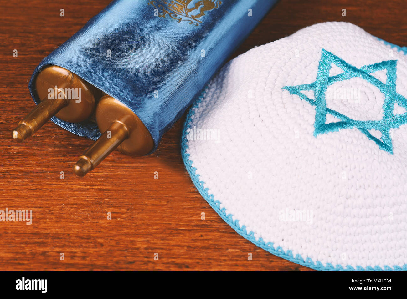 Torah with kippah on wooden background. Jewish religion concept Stock ...