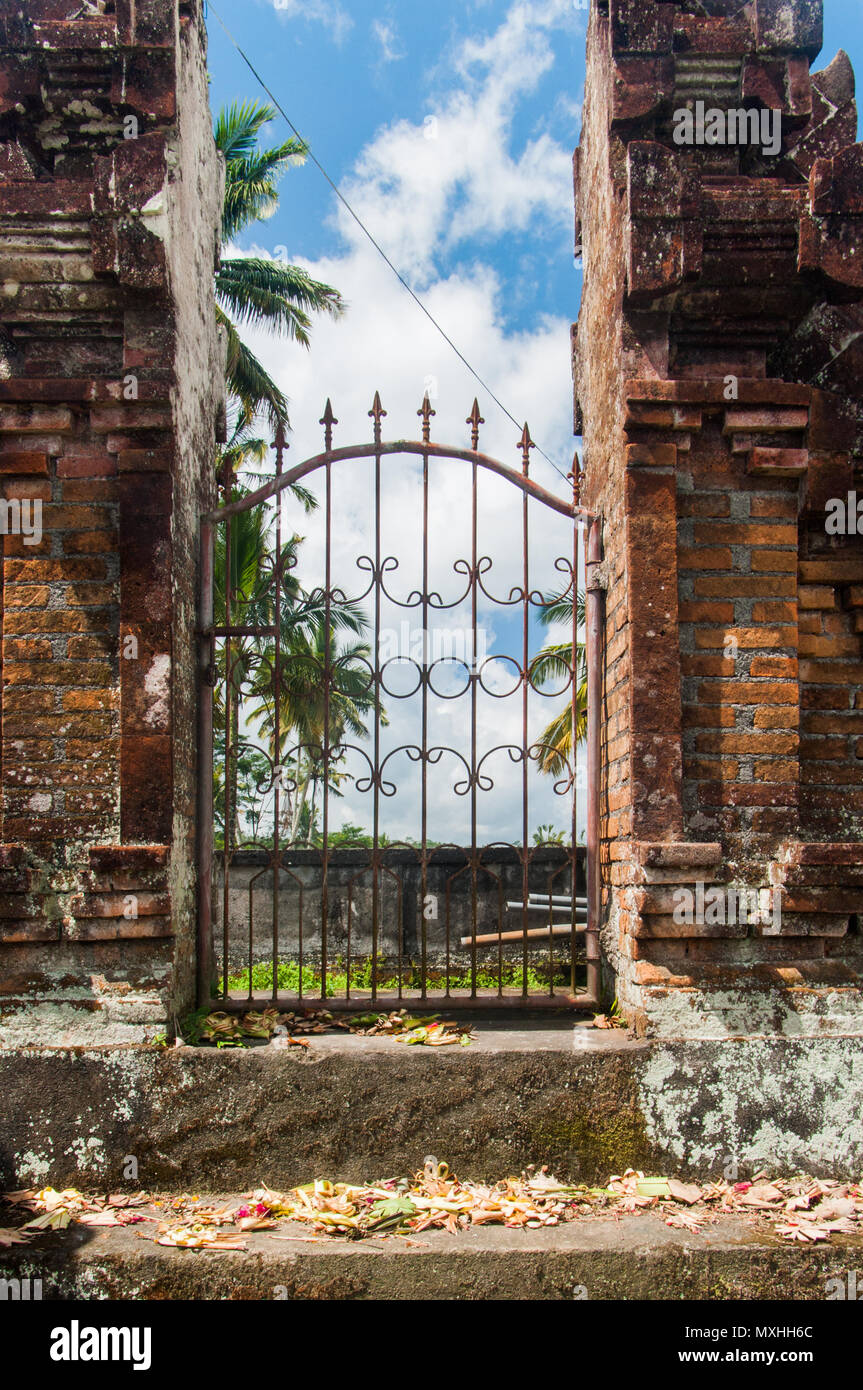 Ornate iron gate decorates the entrance to the temple in Ubud, Bali ...