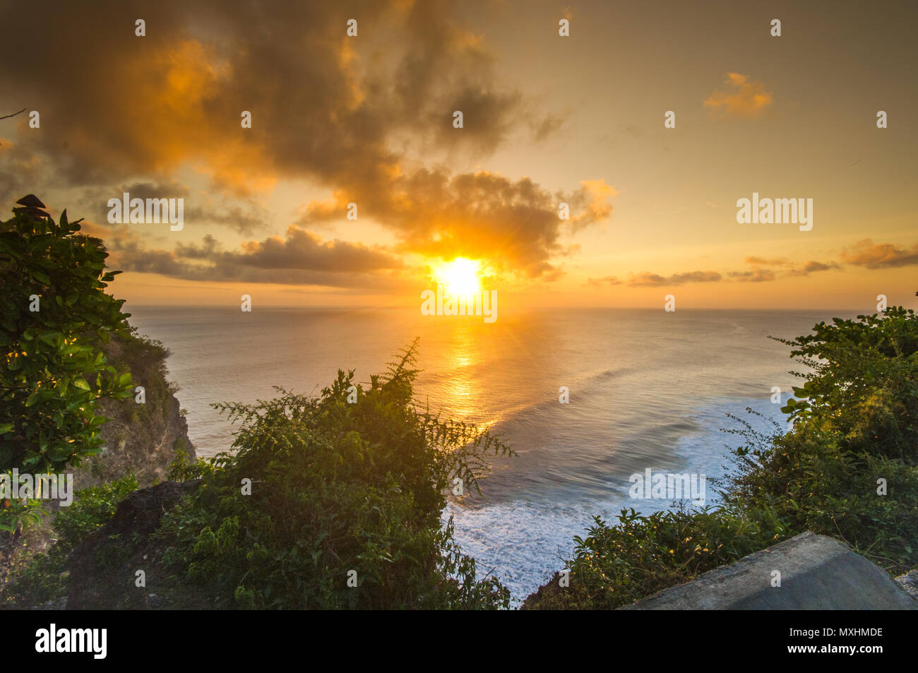 Pura luhur uluwatu temple sunrise hi-res stock photography and images ...