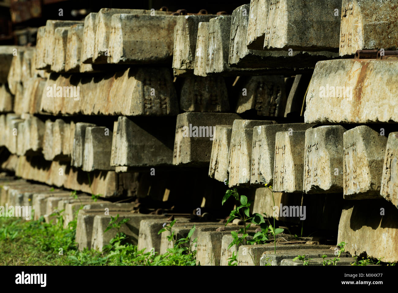 Close-up, detail, redundant concrete railway sleepers stacked in rows ... Close-up, detail, redundant concrete railway sleepers stacked in rows ...