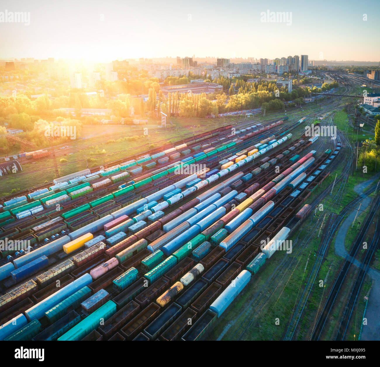 Aerial view of multicolored freight trains. Cargo wagons on railway ...
